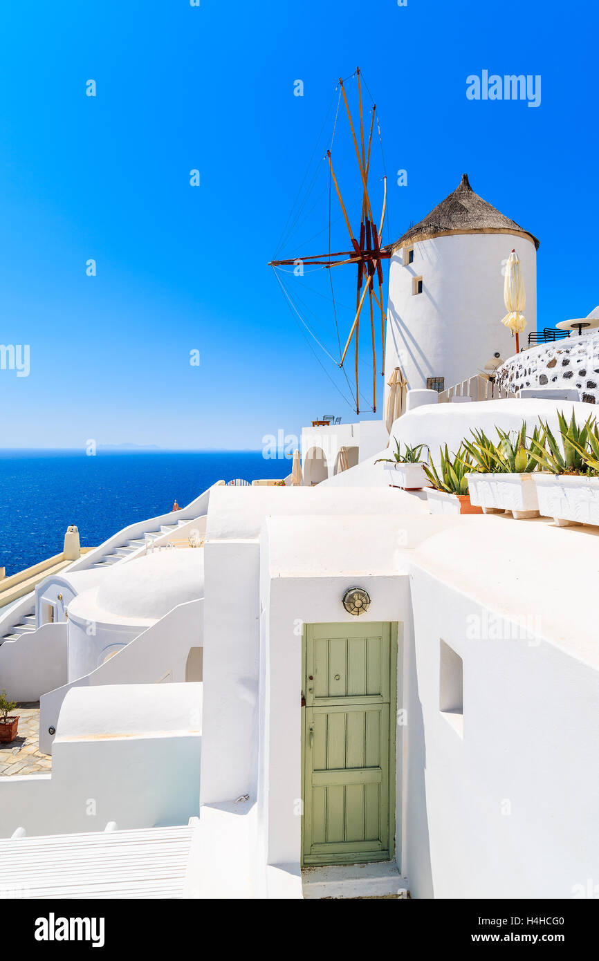 View of famous windmill in Oia village, Santorini island, Greece Stock ...