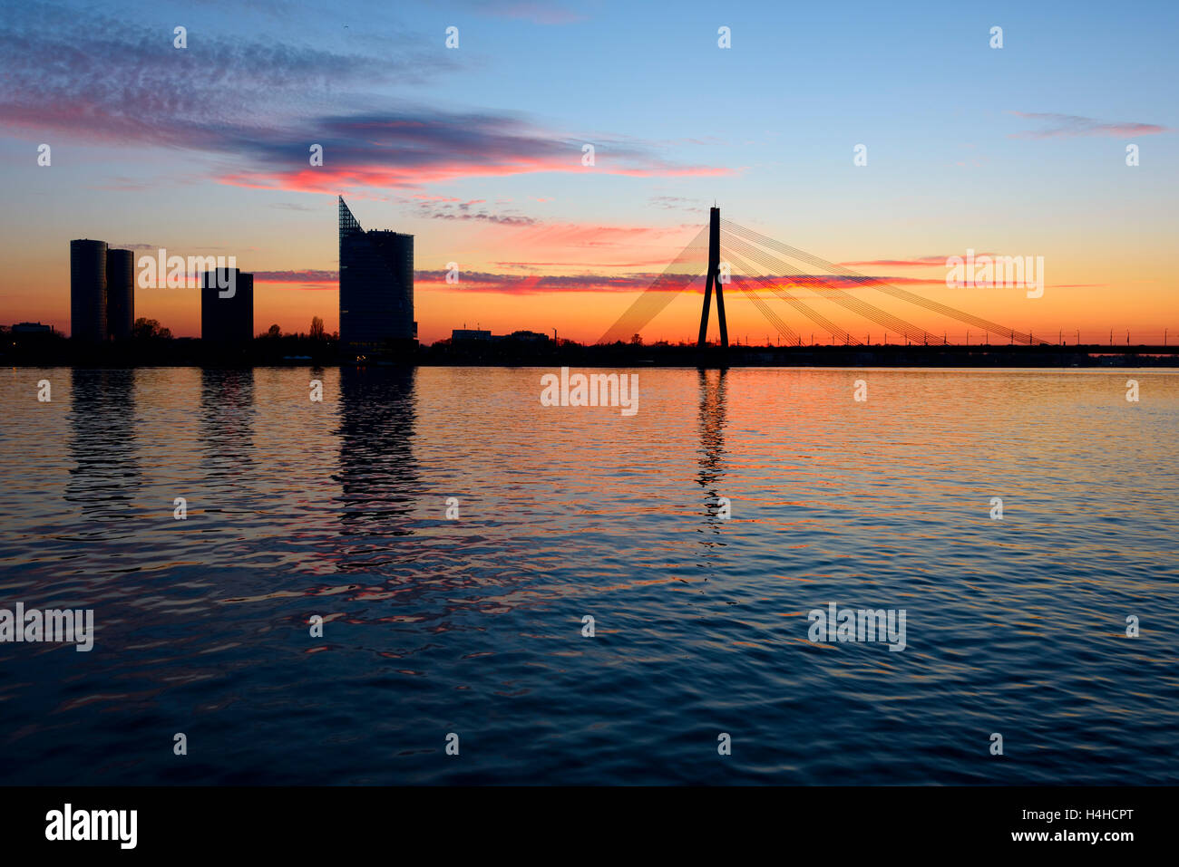 Riga suspension bridge's silhouette at sunset Stock Photo - Alamy