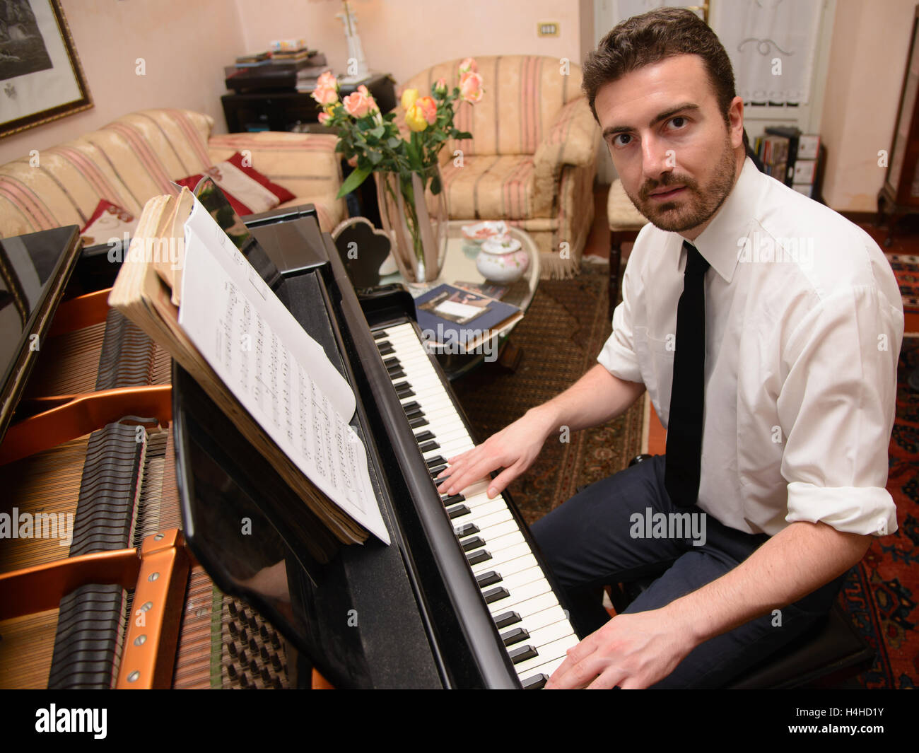 Portrait of music performer playing his piano Stock Photo - Alamy
