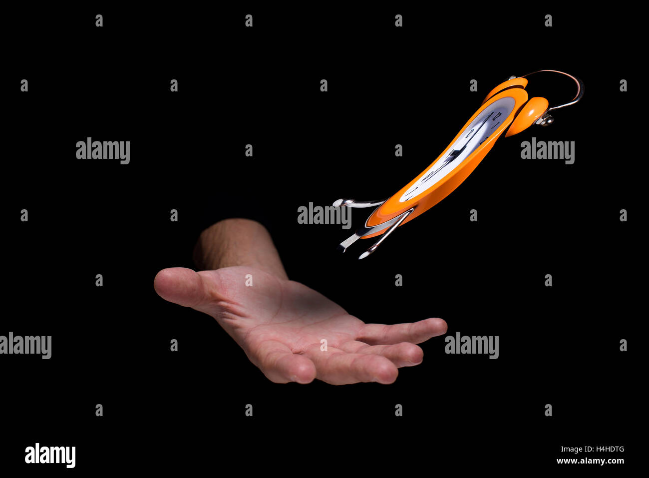 Floating clock over the humans hand.Streched clock in time and space ...