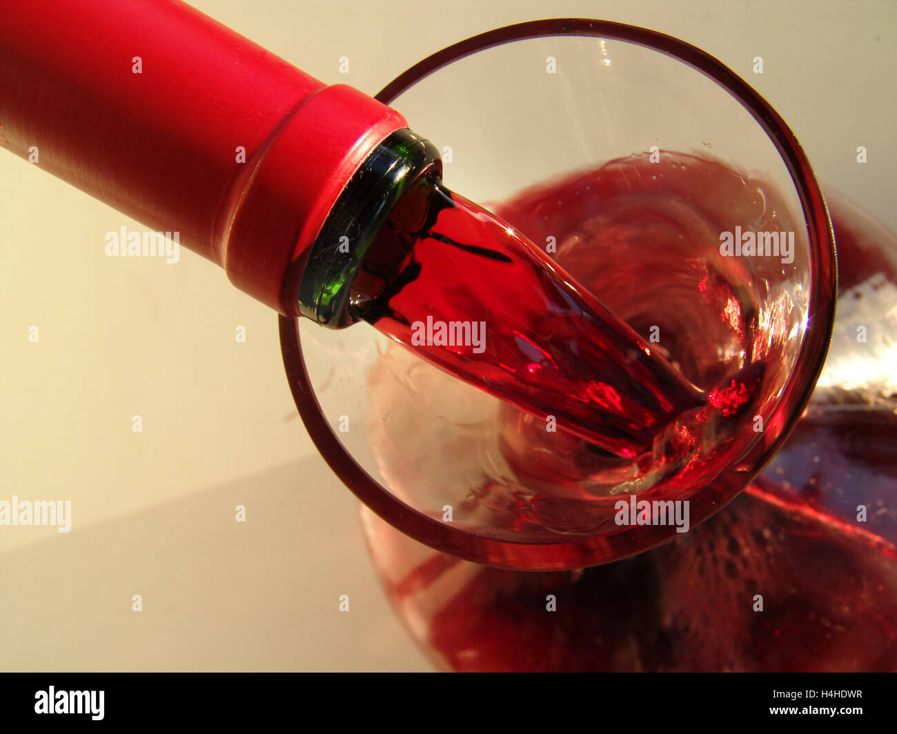 Decanting red wine into a glass decanter close up view to aerate and ...