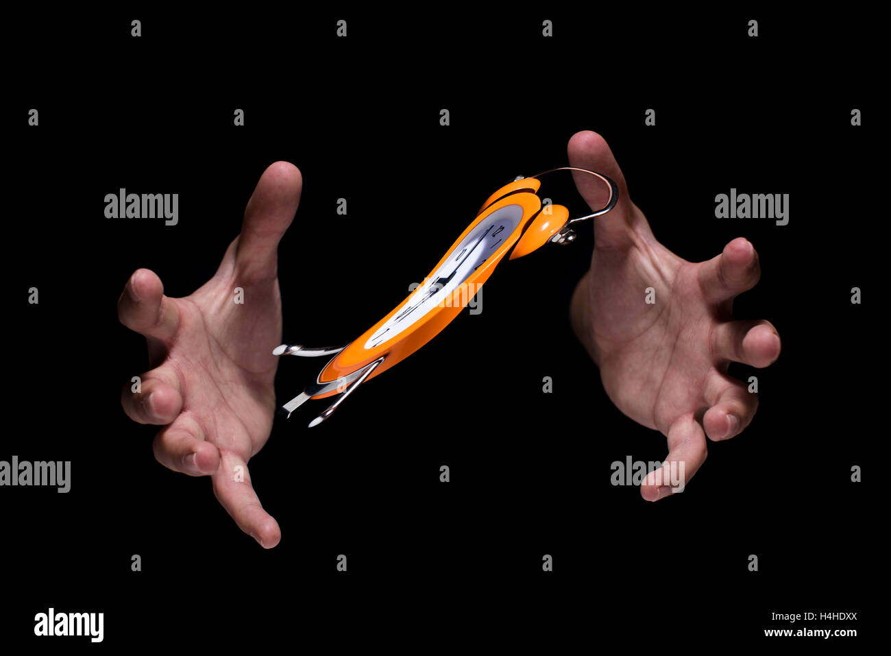 Floating clock between the humans hands.Streched clock in time and ...