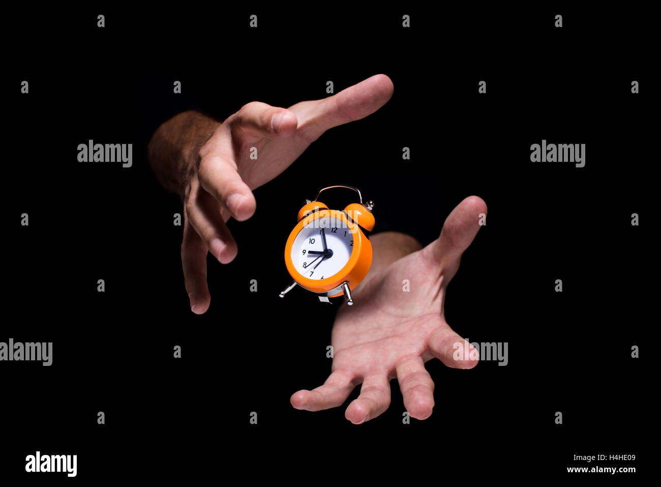 Floating clock between the humans hands.Clock in time and space ...