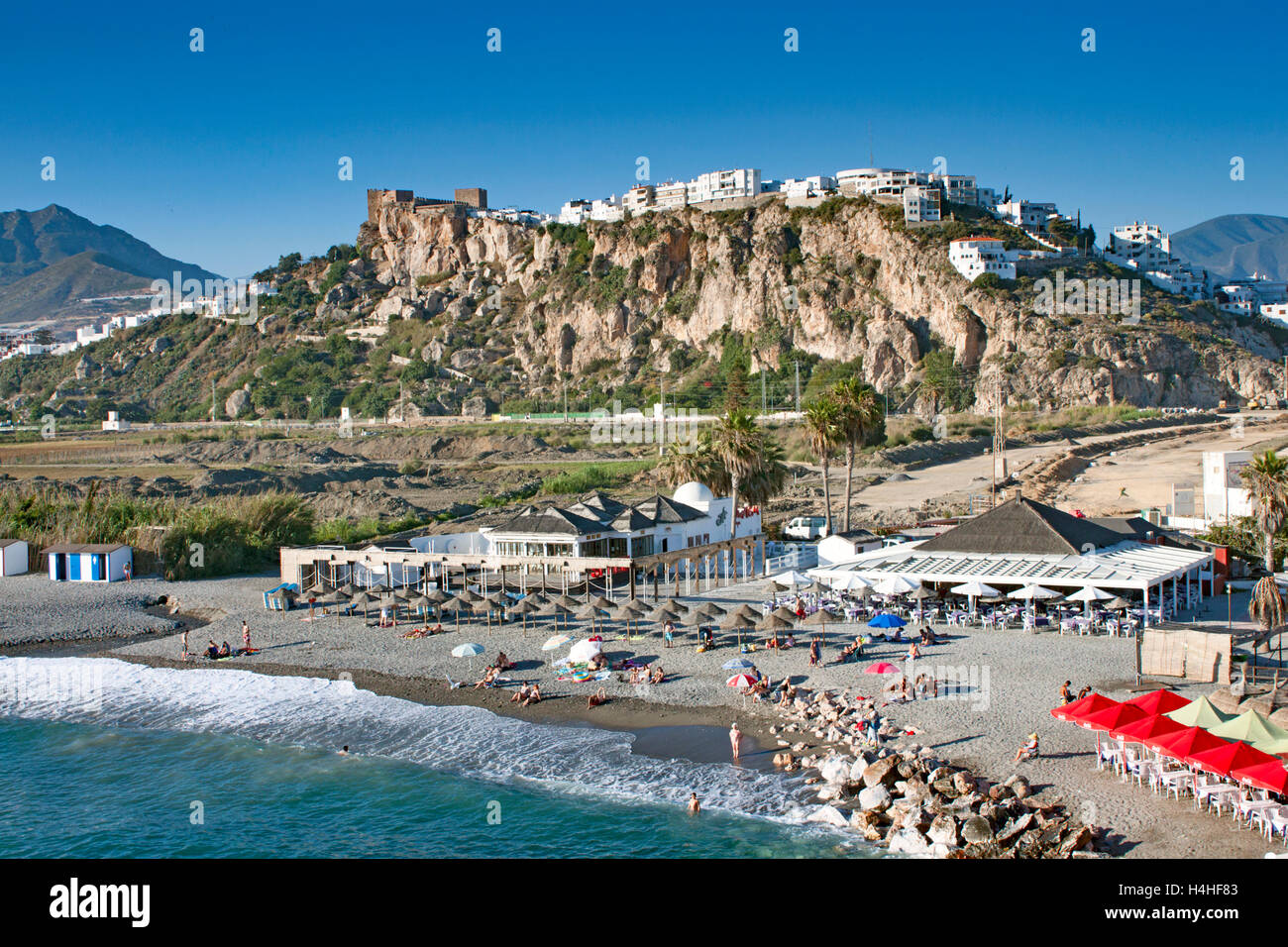 The beach at Salobrena, Costa Tropical, Spain, with restaurants and the ...