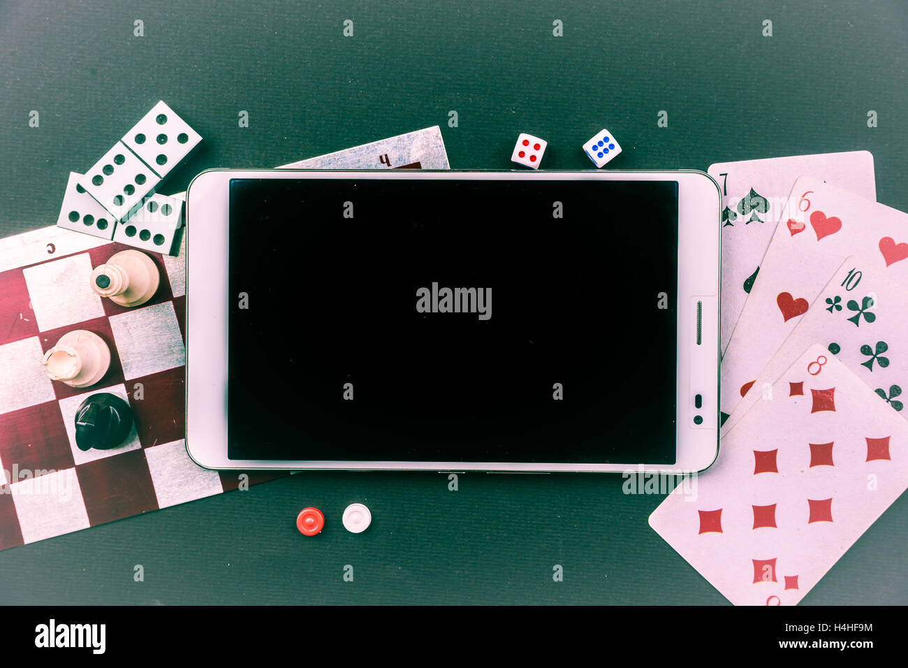 Various board games with tablet pc Stock Photo - Alamy