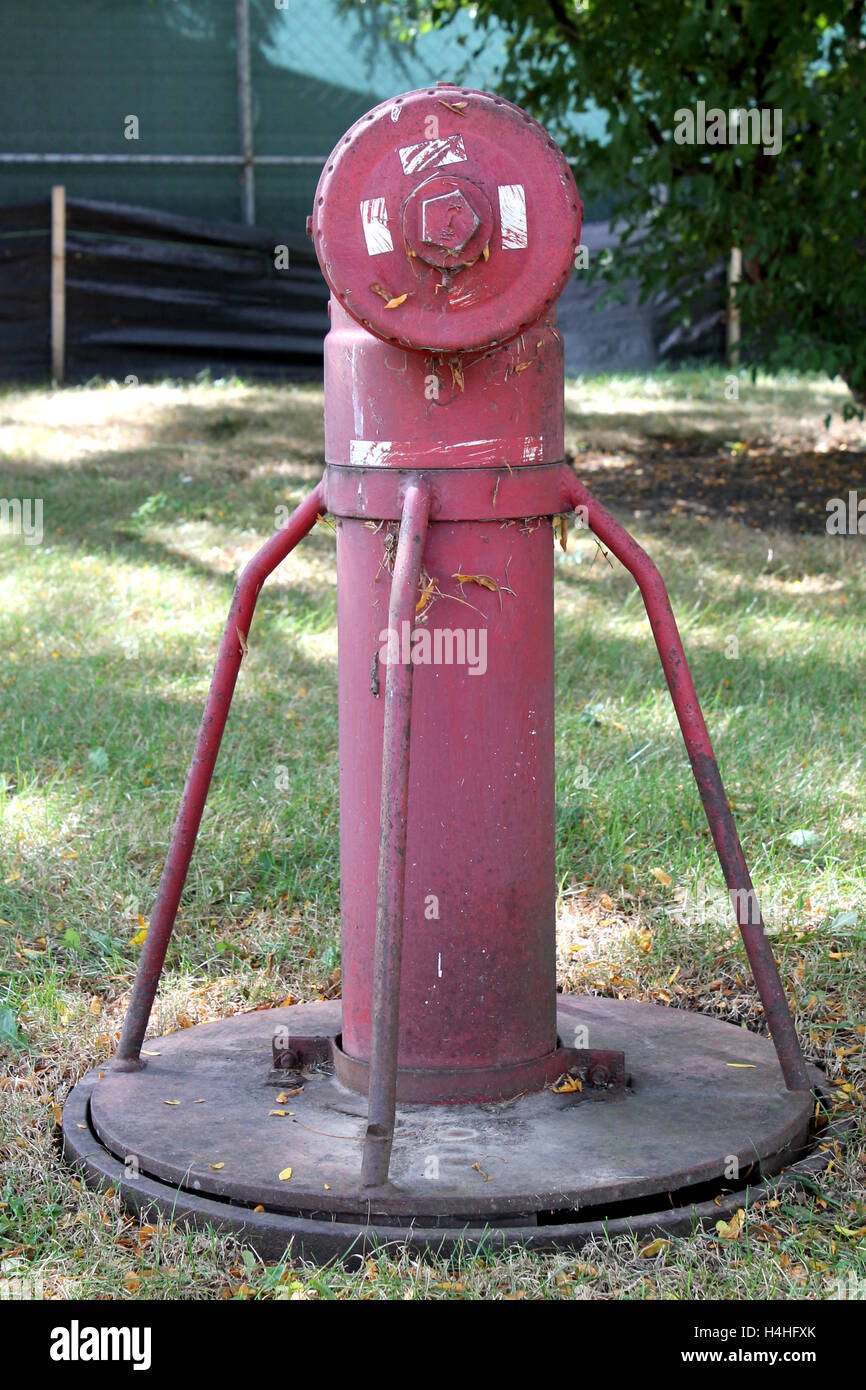An old, dirty red fire hydrant in a field Stock Photo - Alamy