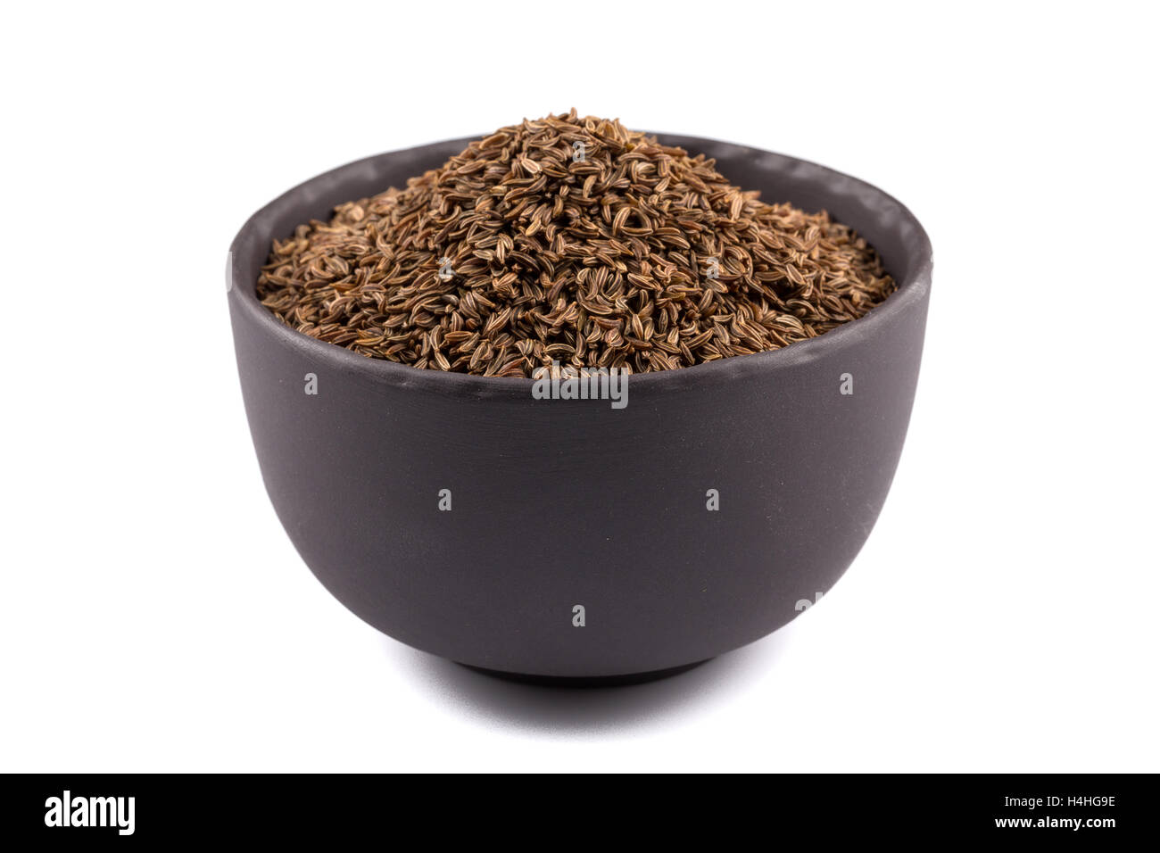 Stone bowl and pile of cumin seeds isolated on white background Stock ...