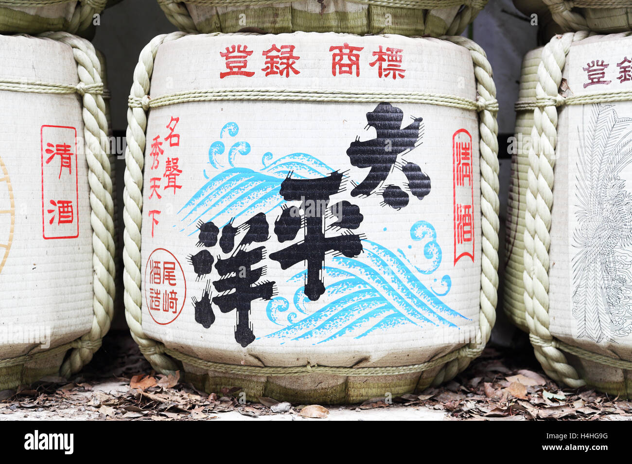 Detail of a traditional japanese sake cask surrounded by other casks in ...