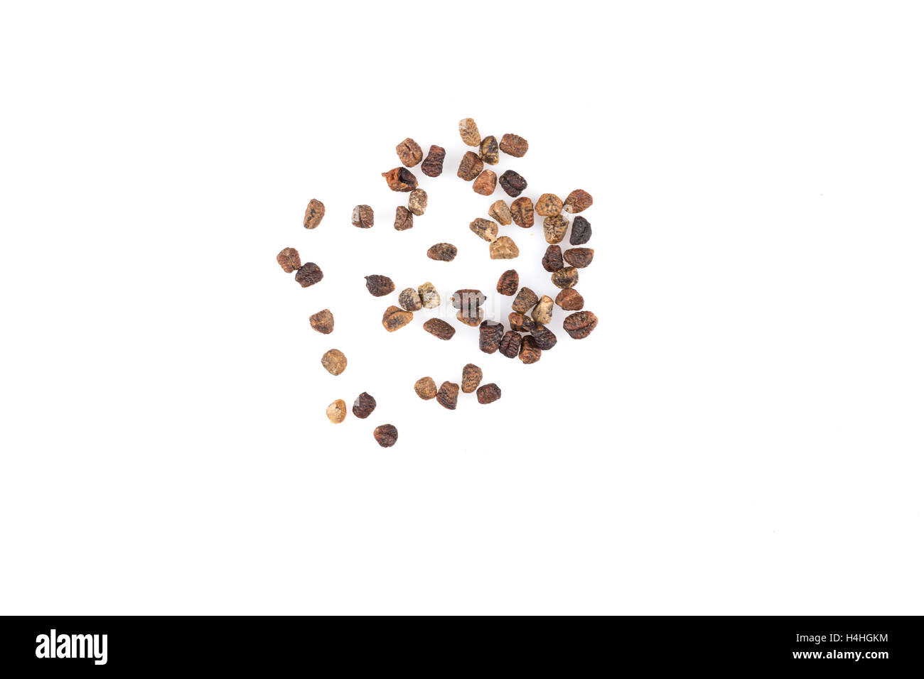 Decorticated cardamom seeds pile on a white background Stock Photo - Alamy