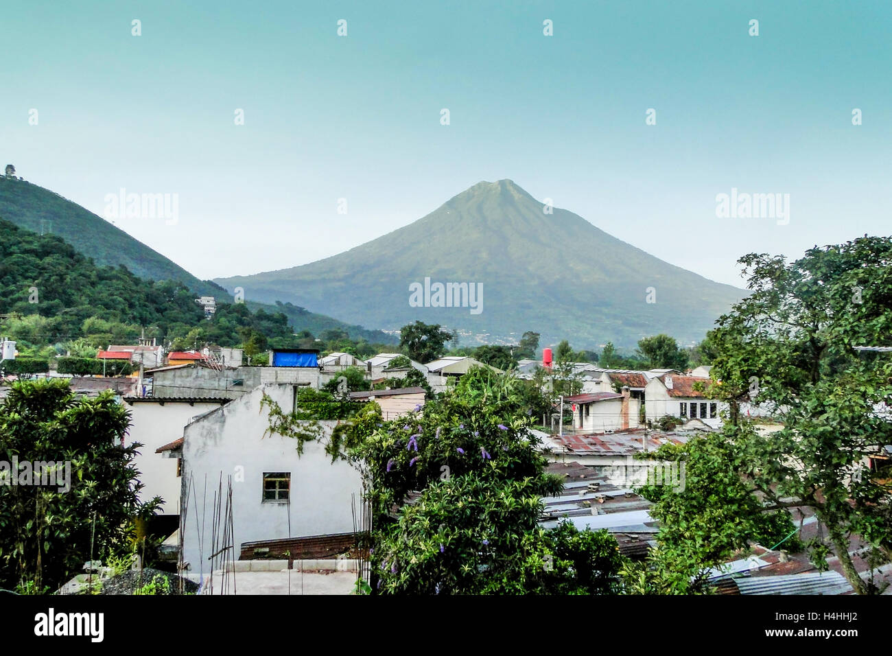 Agua Volcano at dusk from the roof of a home in Antiqua, Guatemala ...
