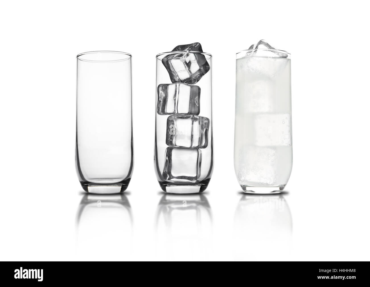 Glass of lemon lemonade with ice cubes and bubbles with reflection on ...