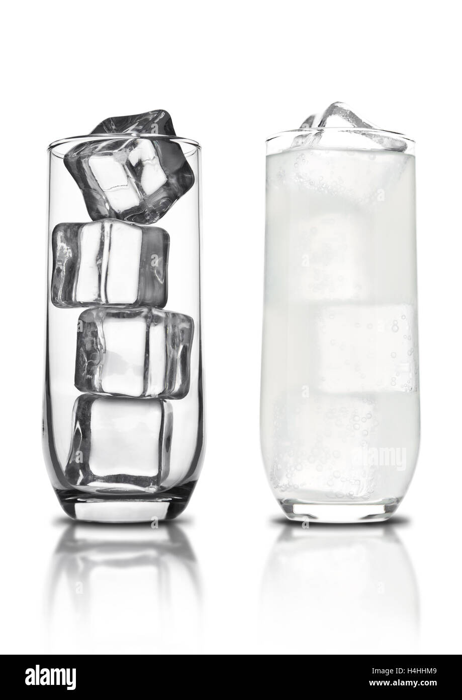 Glass of lemon lemonade with ice cubes and bubbles with reflection on ...