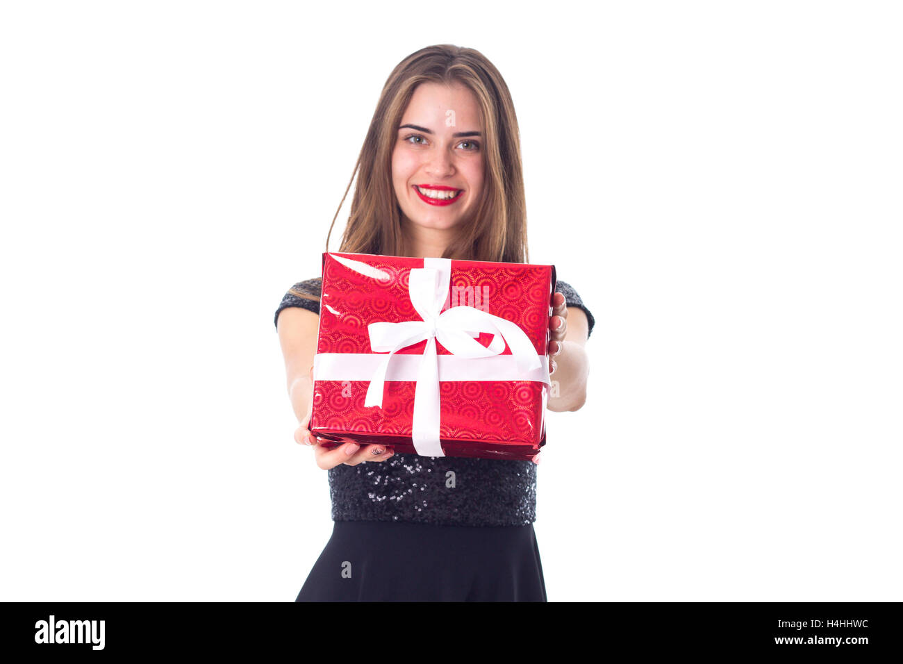 Young woman showing a present Stock Photo - Alamy