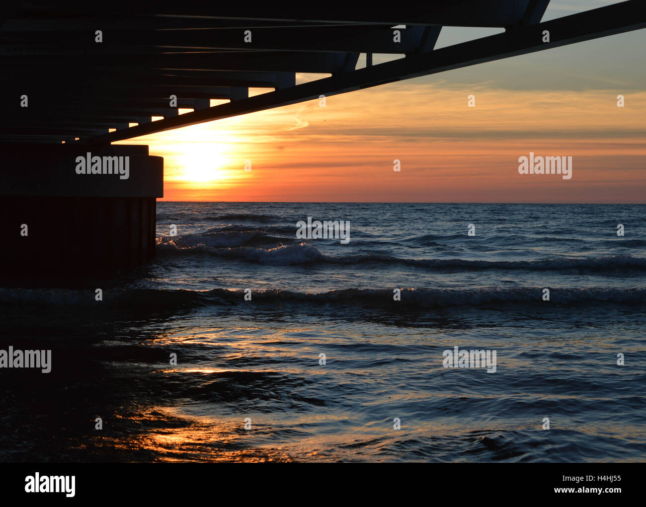 Brilliant sunrise on the waters of Lake Huron at the pier in Oscoda ...