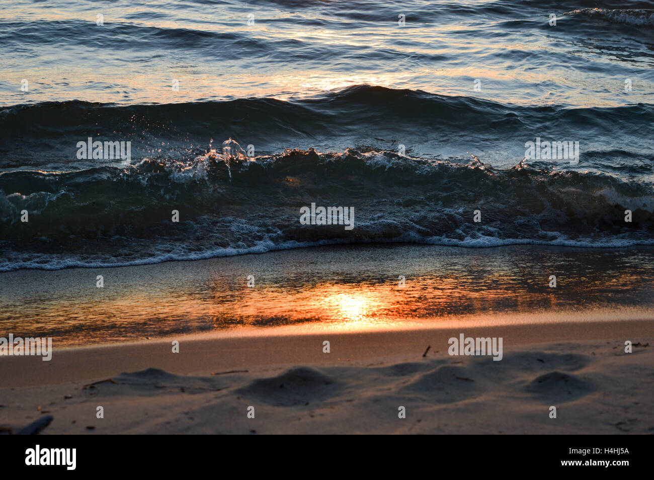 Brilliant sunrise on the waters of Lake Huron at the pier in Oscoda ...
