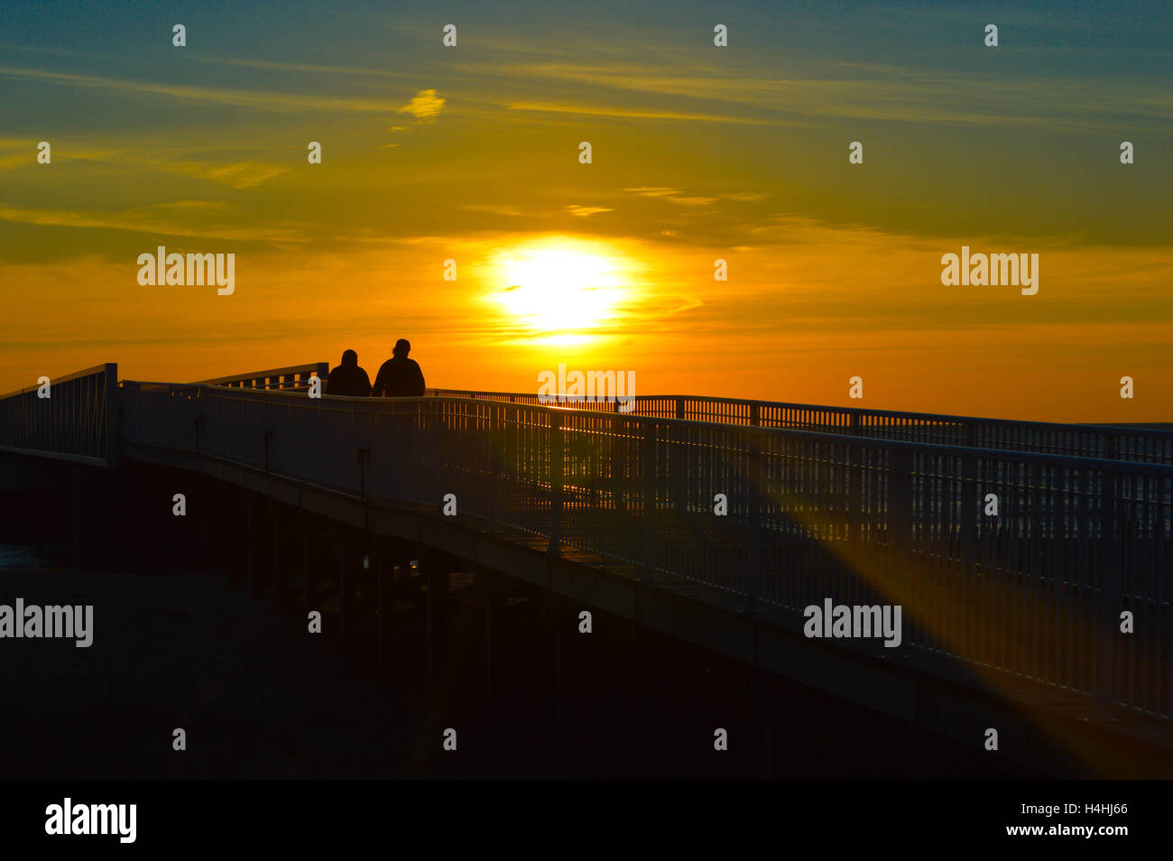 Brilliant sunrise on the waters of Lake Huron at the pier in Oscoda ...