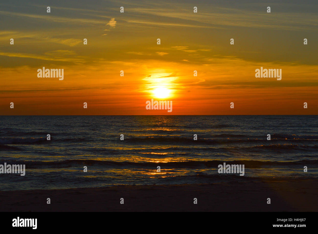 Brilliant sunrise on the waters of Lake Huron at the pier in Oscoda ...