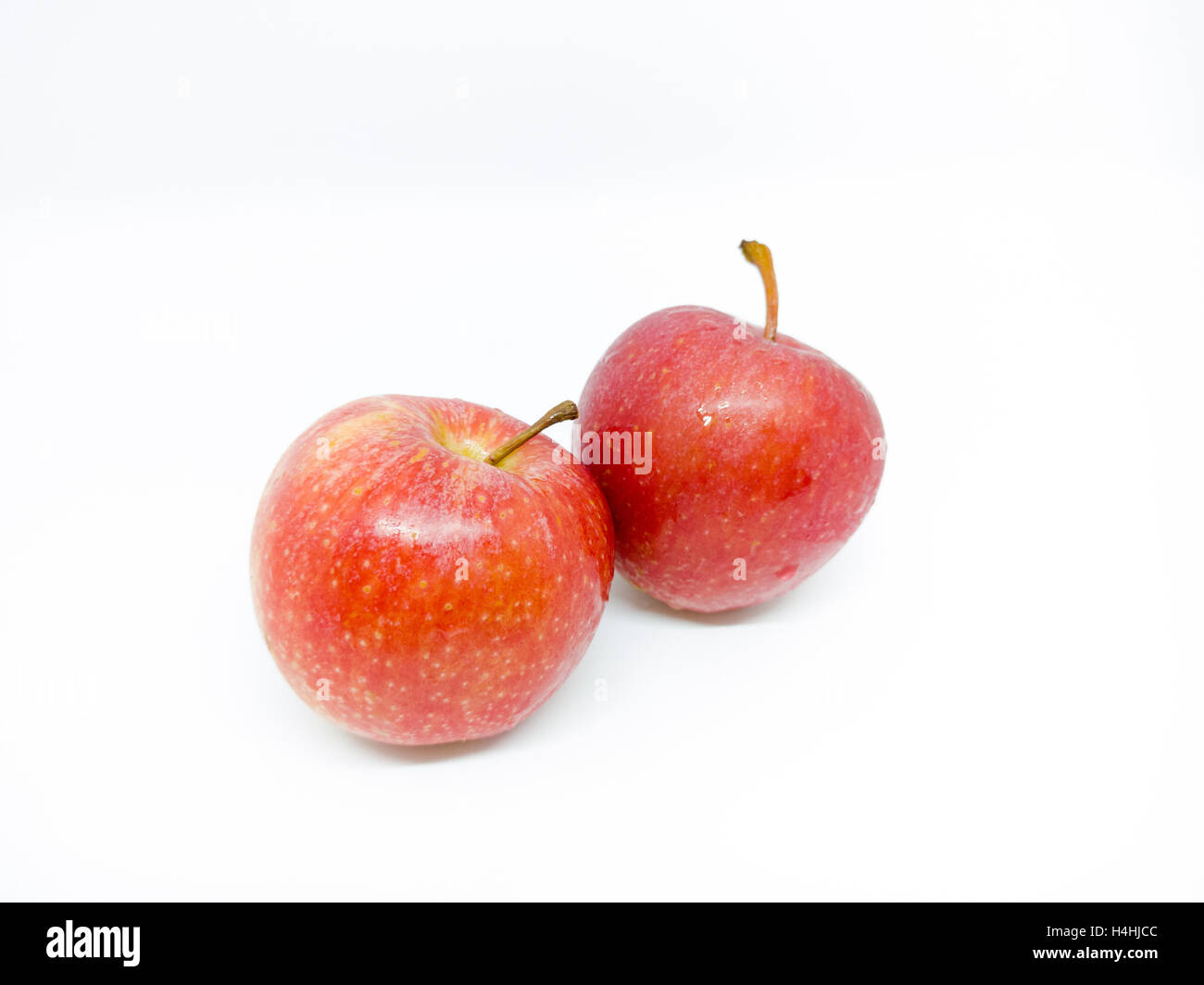 Two red apples isolated on white background Stock Photo - Alamy