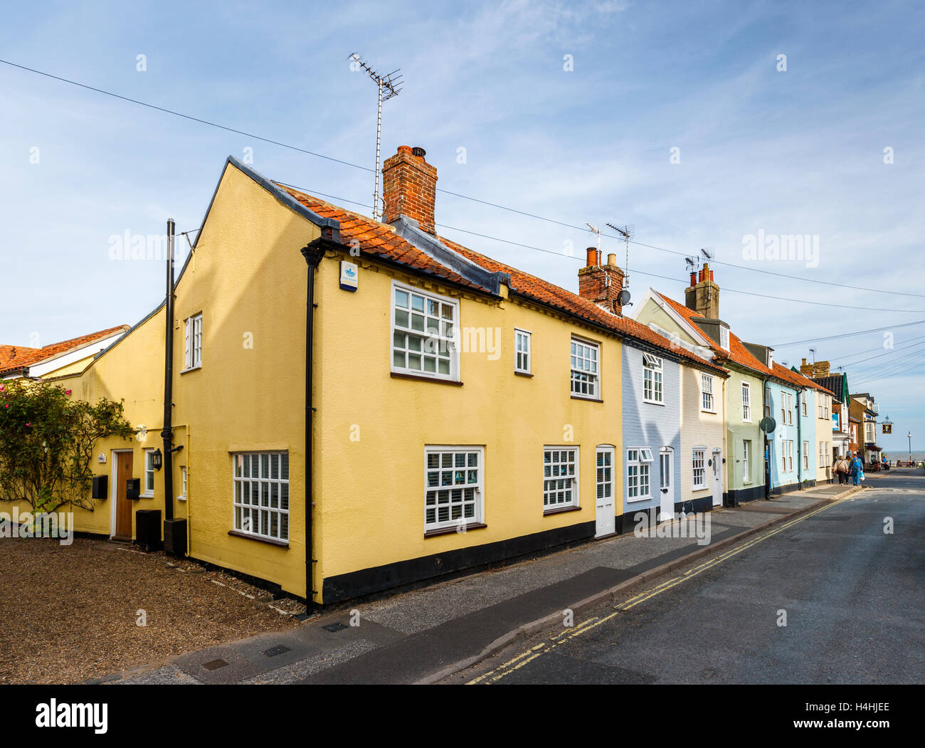 Row of typical pretty pastel coloured terraced cottages in Southwold ...
