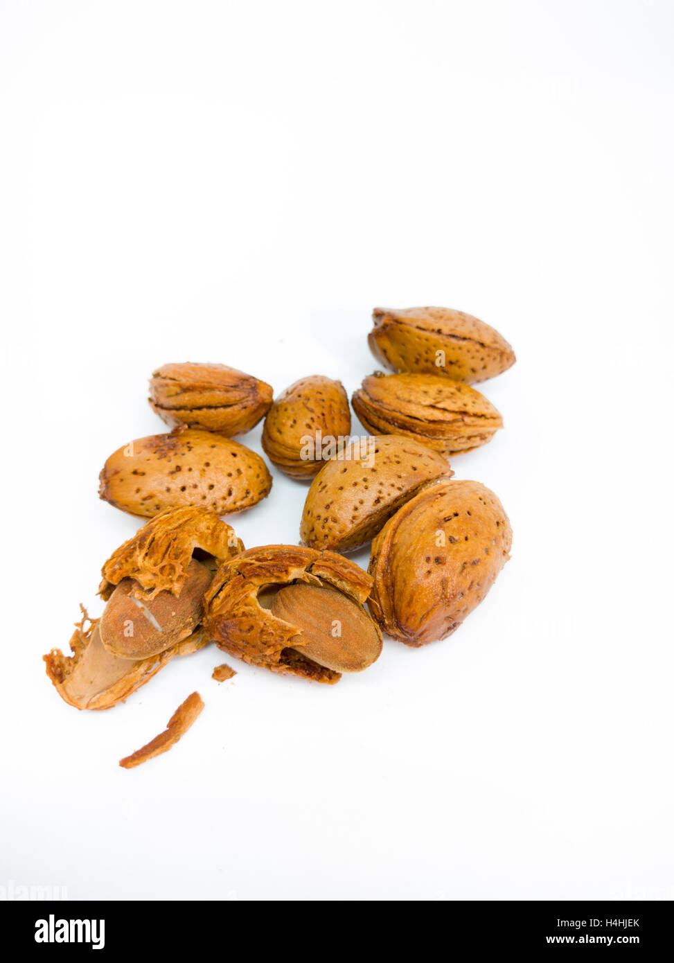 A bunch of almonds isolated on white background Stock Photo - Alamy