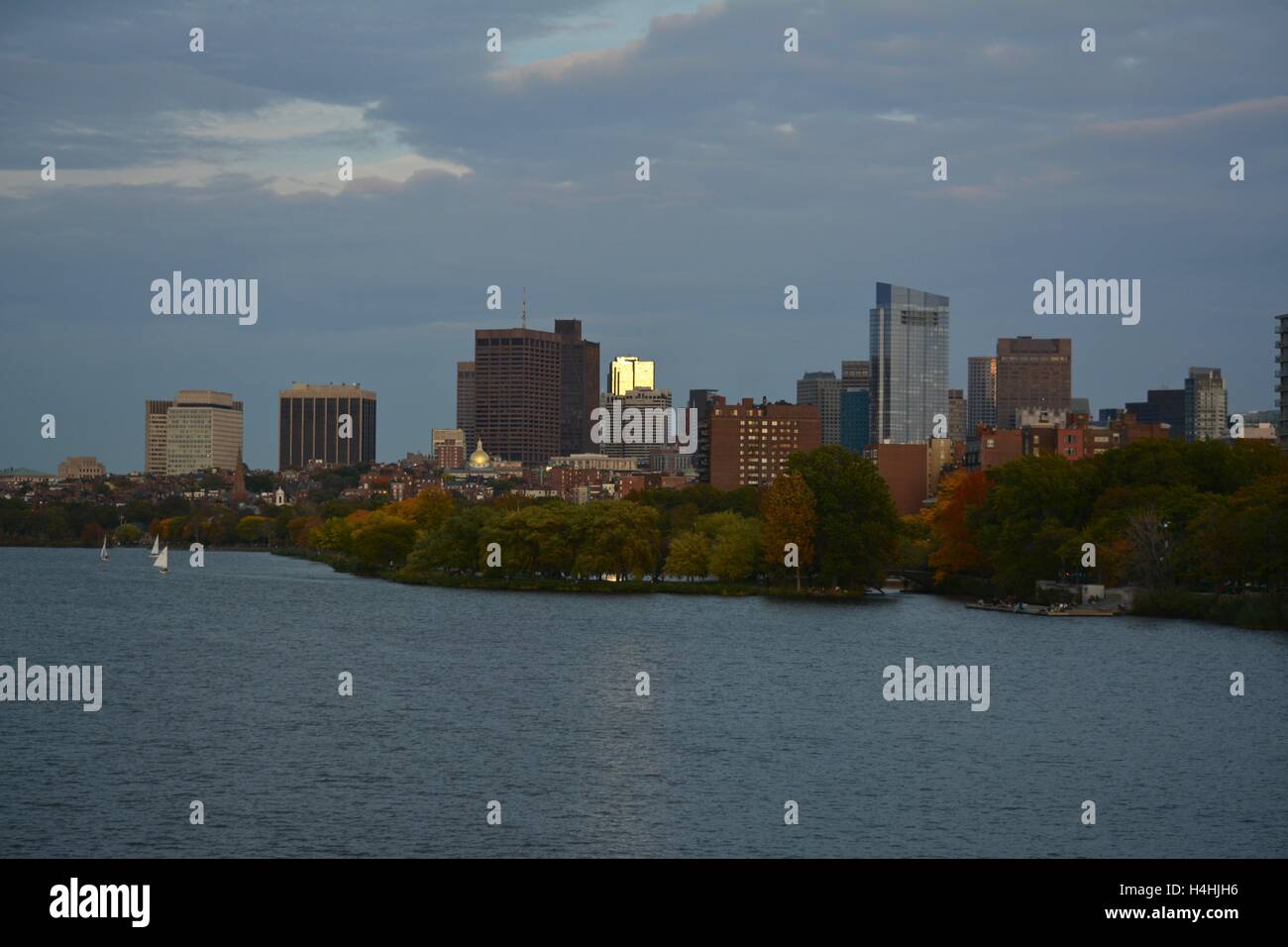 A view of the downtown Boston skyline at Sunset from Cambridge across ...