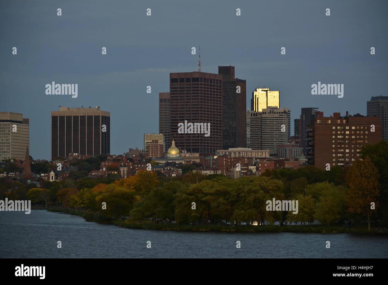 A view of the downtown Boston skyline at Sunset from Cambridge across ...