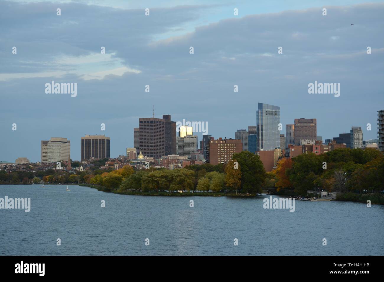 A view of the downtown Boston skyline at Sunset from Cambridge across ...
