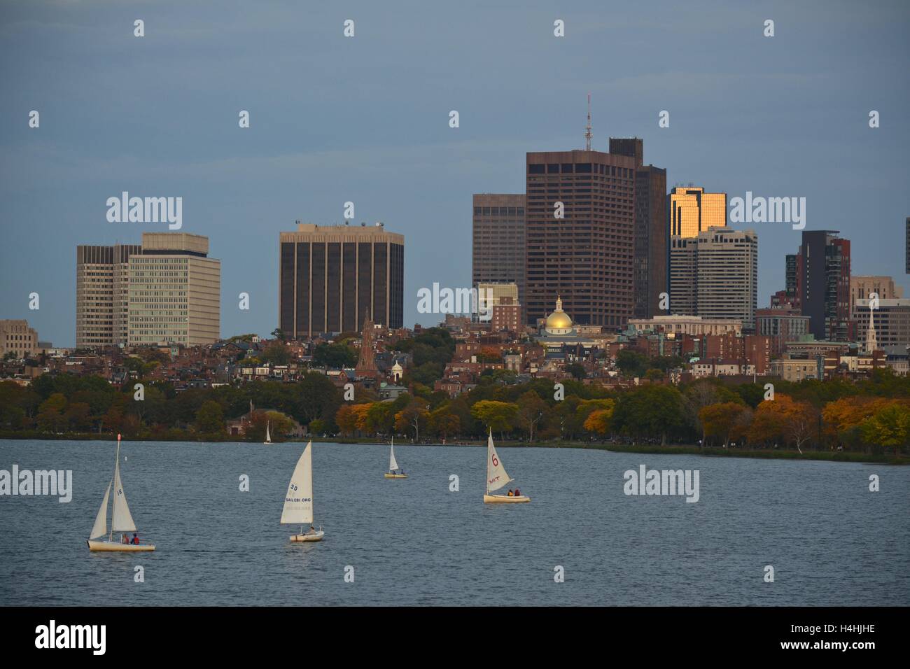 A view of the downtown Boston skyline at Sunset from Cambridge across ...