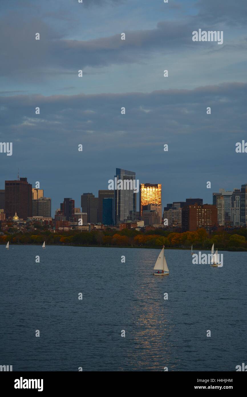A view of the downtown Boston skyline at Sunset from Cambridge across ...