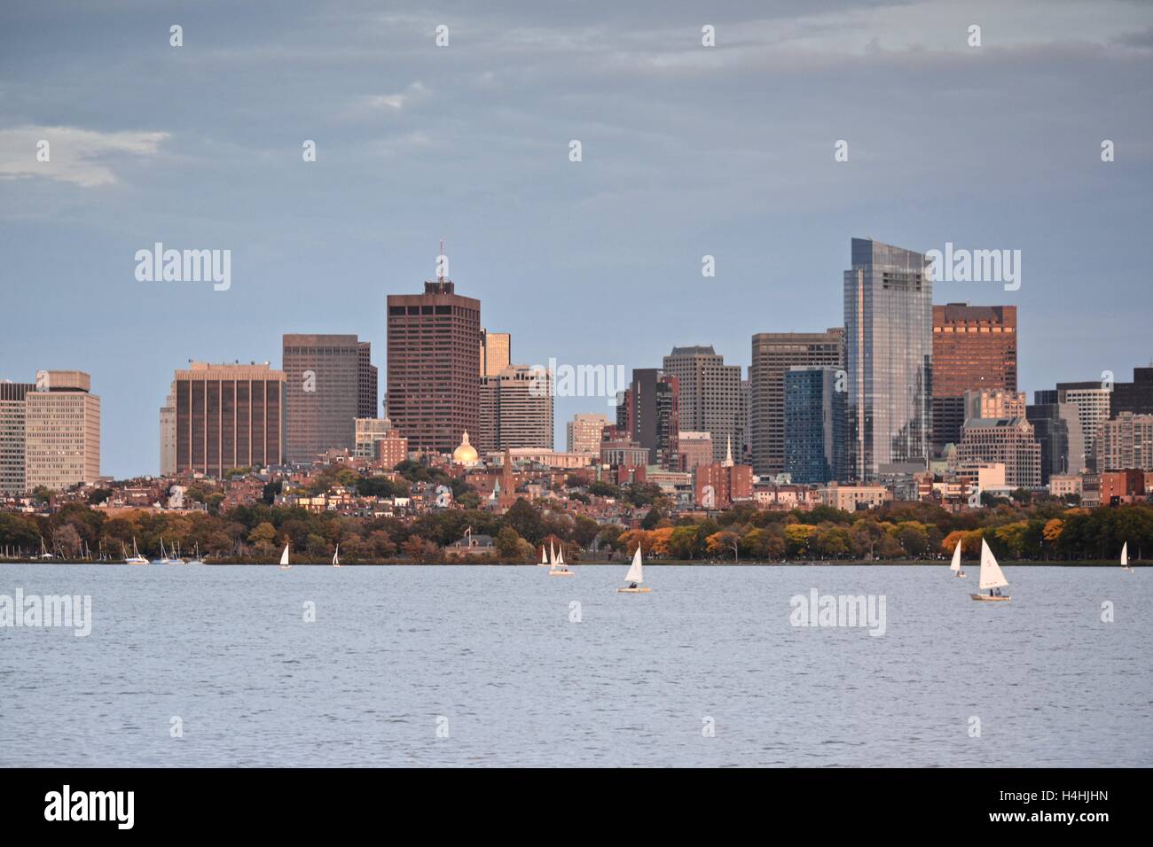 A view of the downtown Boston skyline at Sunset from Cambridge across ...