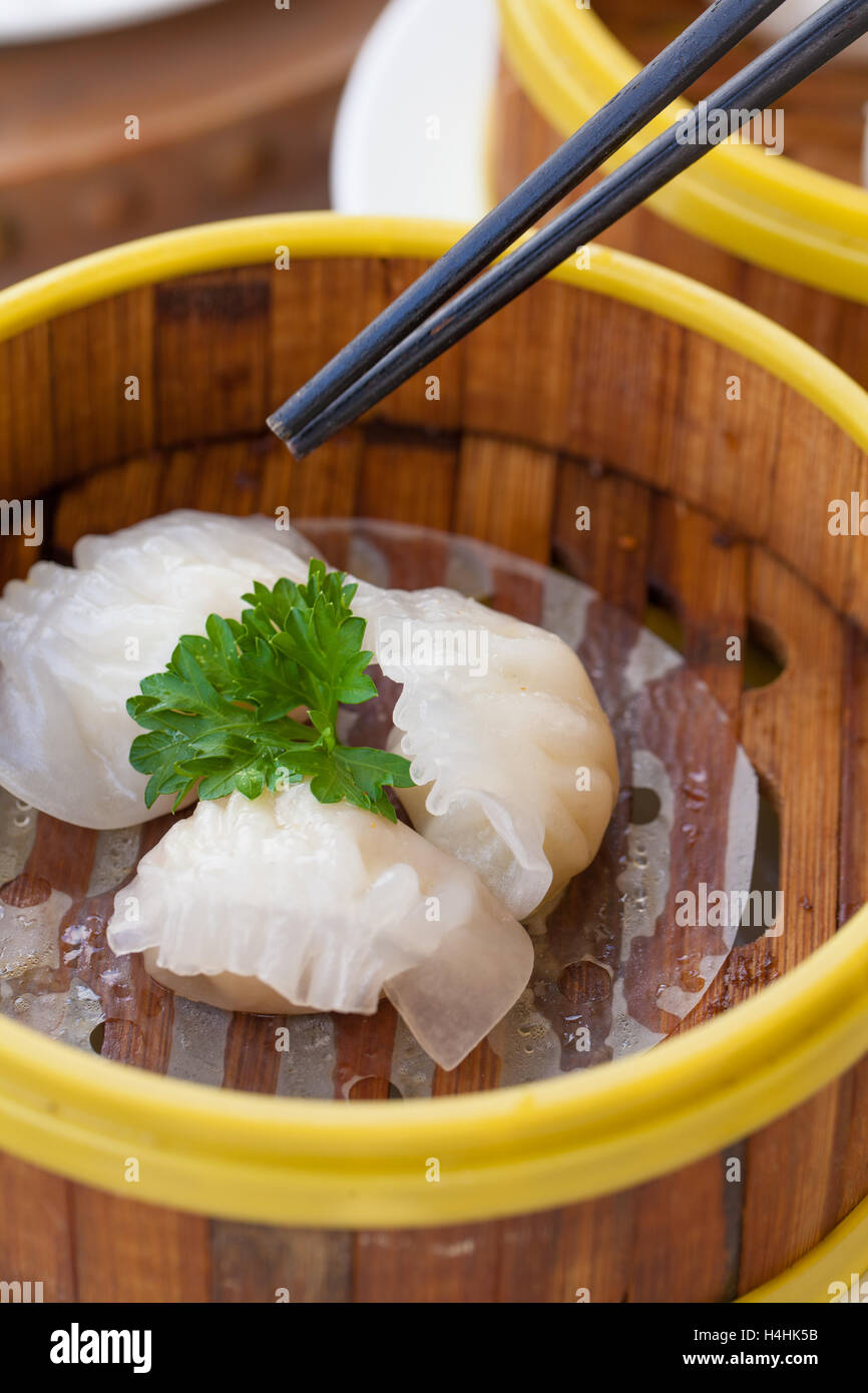 Chinese steamed white dumpling or Hakau Dim sum stuffed with minced ...