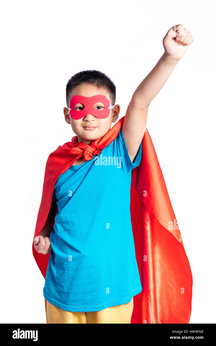 Asian Chinese boy wearing super hero costume in isolated white ...