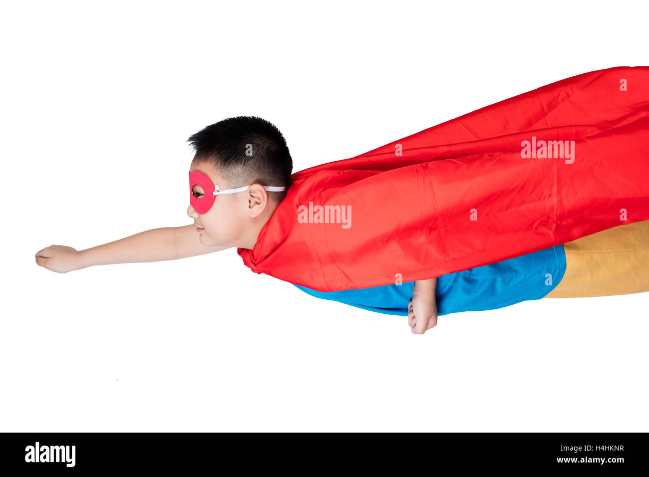 Asian Chinese boy wearing super hero costume in isolated white ...