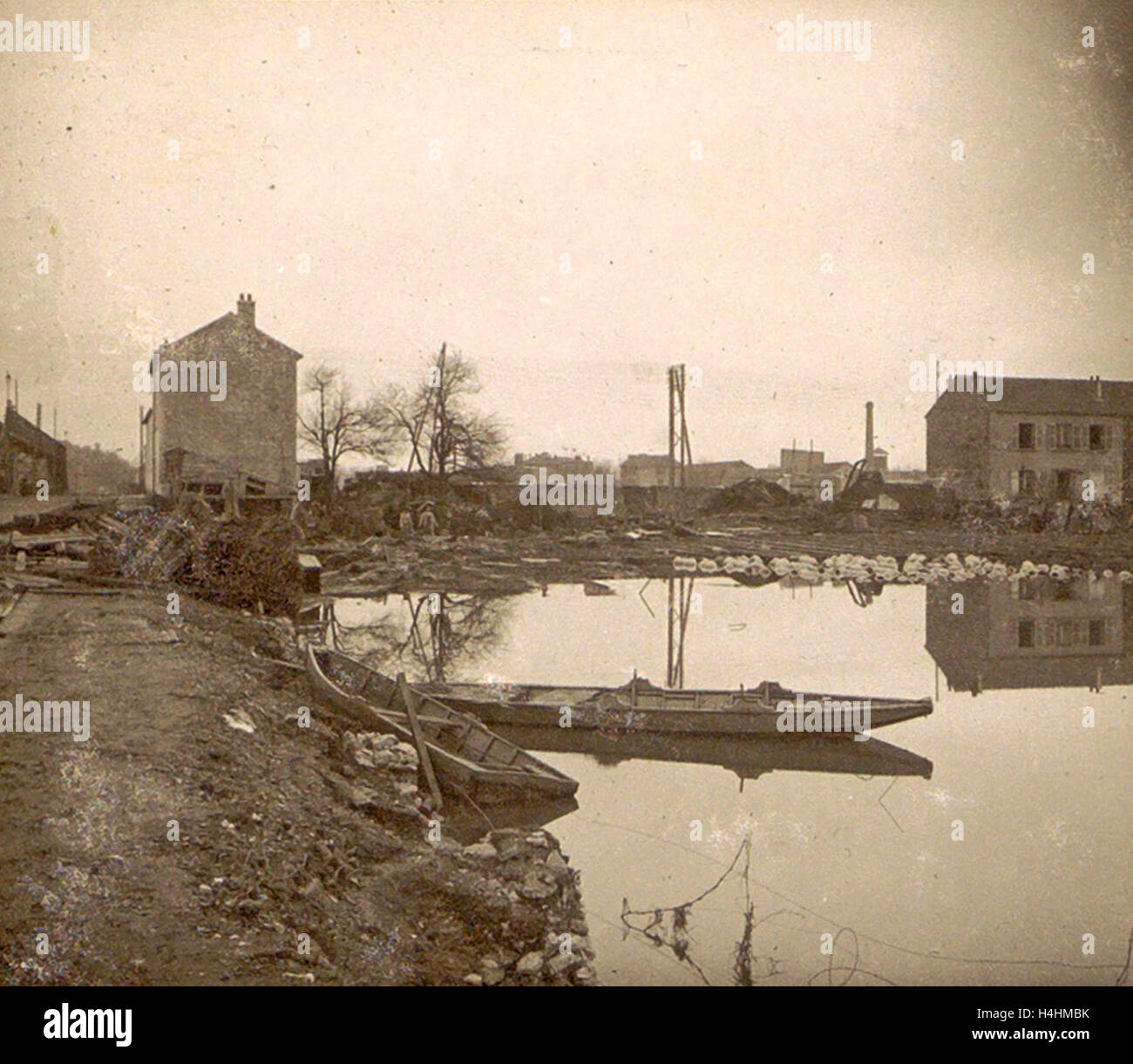 Boat and houses in a flooded suburb of Paris, France, 1910 Stock Photo ...