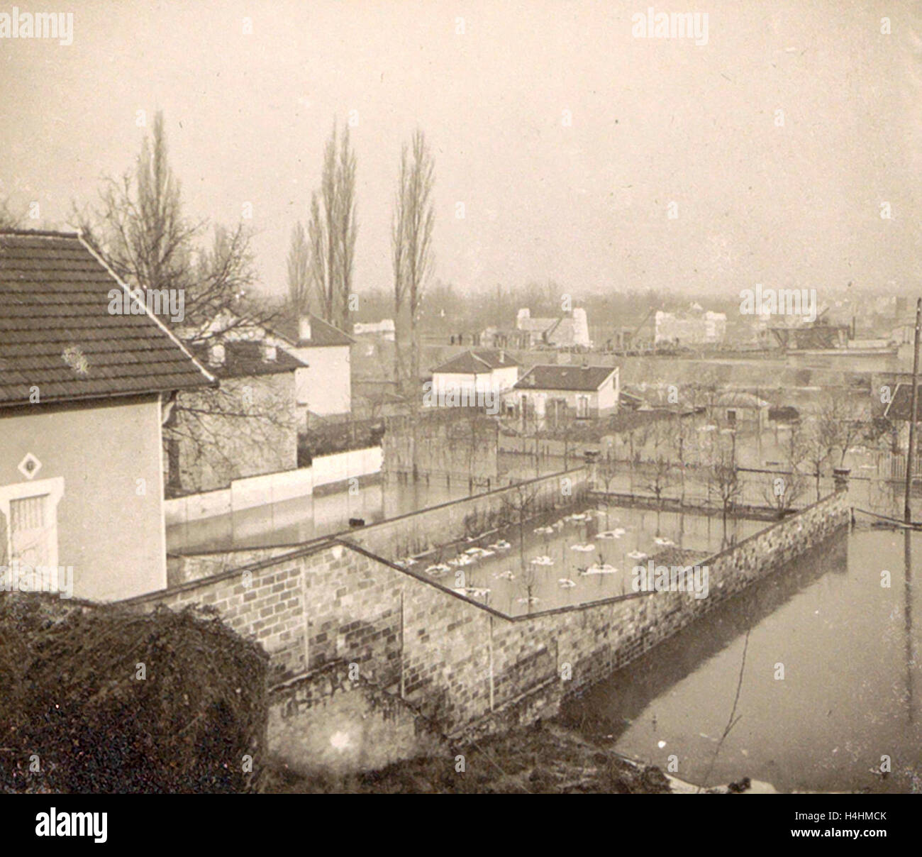 Houses and gardens in a flooded suburb of Paris, France, jan-1910 Stock ...