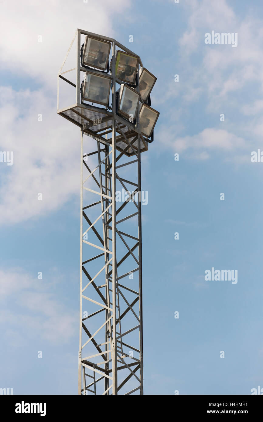 Metallic stadium light post over a blue sky. Vertical Stock Photo - Alamy