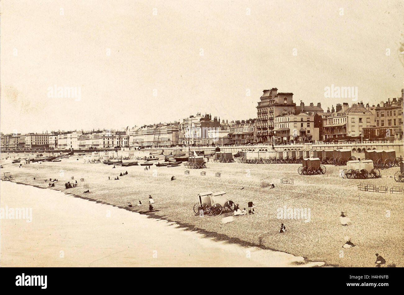 Buildings, bathers and bathing carriages on Brighton beach UK ...