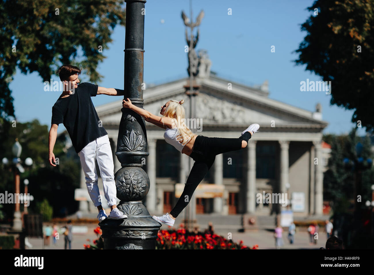 man and woman performing acrobatic tricks Stock Photo - Alamy
