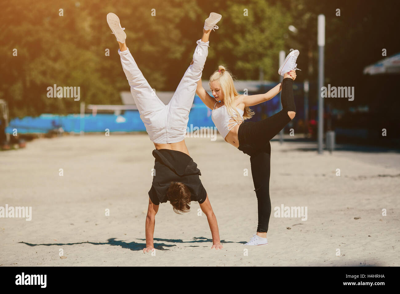man and woman performing tricks Stock Photo - Alamy