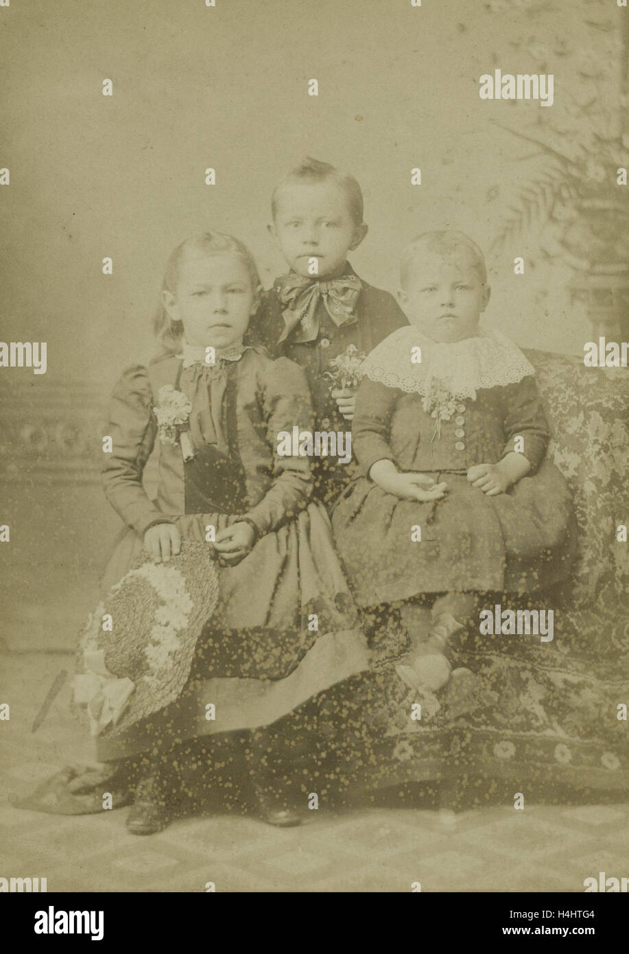 Group portrait of three children in studio, A.M. Burgess, 1870 - 1900 ...
