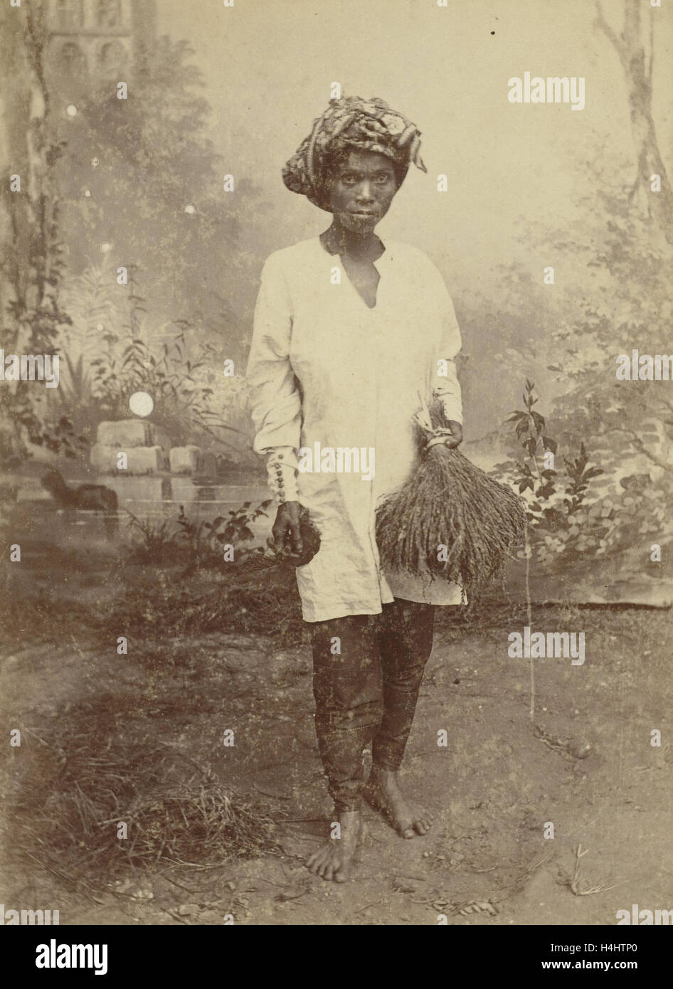 Studio Portrait of woman with paddy in her hand, Anonymous, 1870 - 1900 ...
