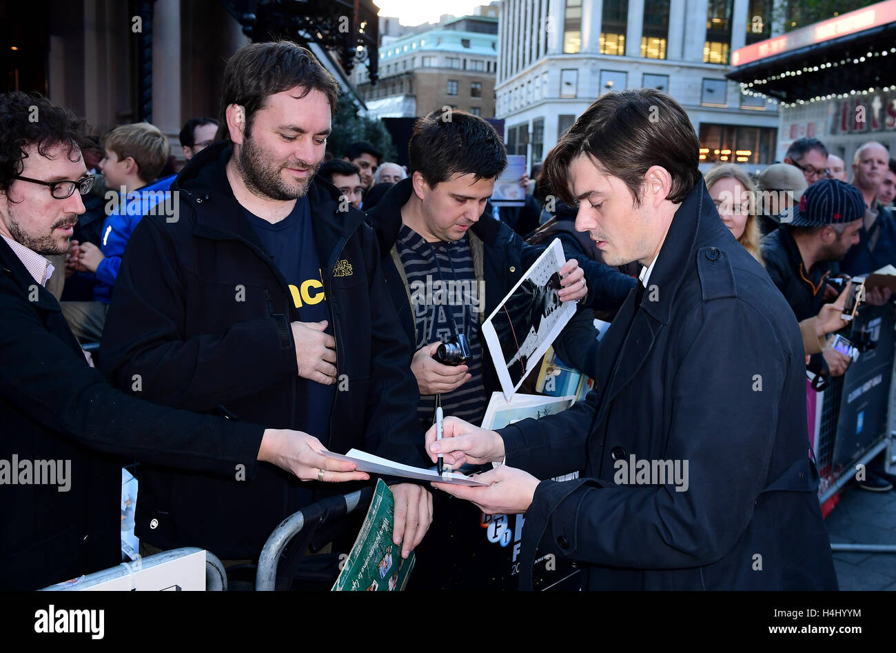 Sam Riley signs autographs whilst attending the 60th London Film ...