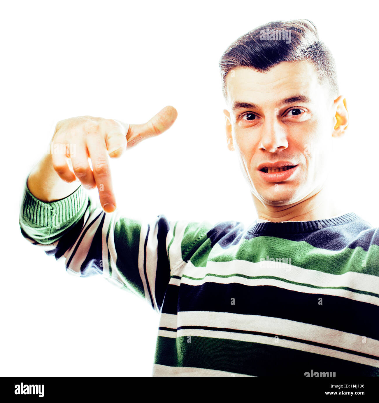 Portrait of a smart serious young man standing against white bac Stock ...