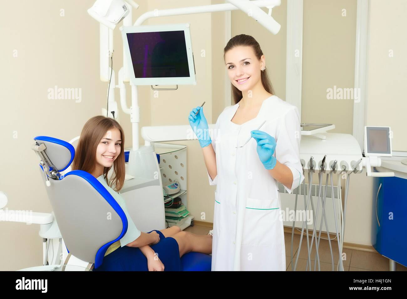 Attractive Woman Dentist With Girl Patient Stock Photo Alamy