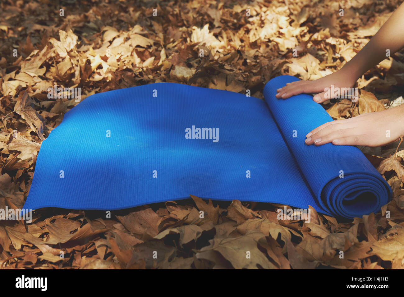 Close up view of blue open yoga mat for exercise, isolated in the ...