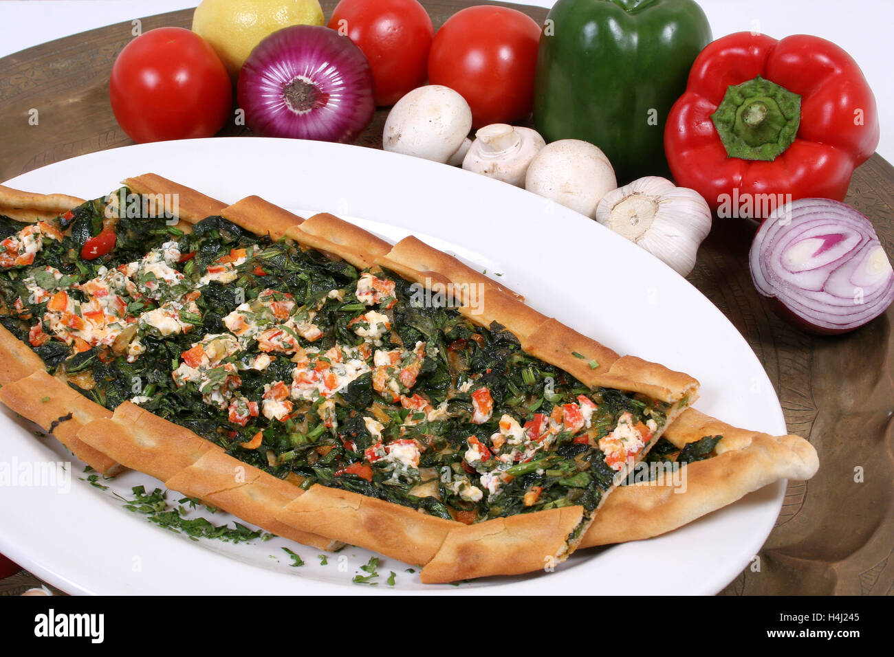 Turkish pizza (pide) with spinach Stock Photo - Alamy