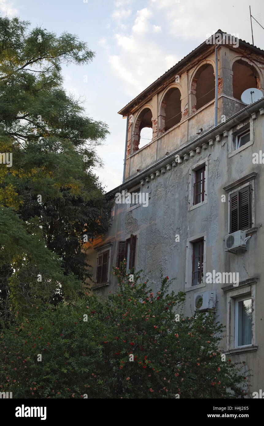 Old Mediterranean Storey Building at Twilight with Bush and Tree Stock ...