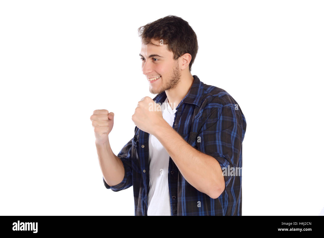 Close up of young latin man celebrating victory. Isolated white ...