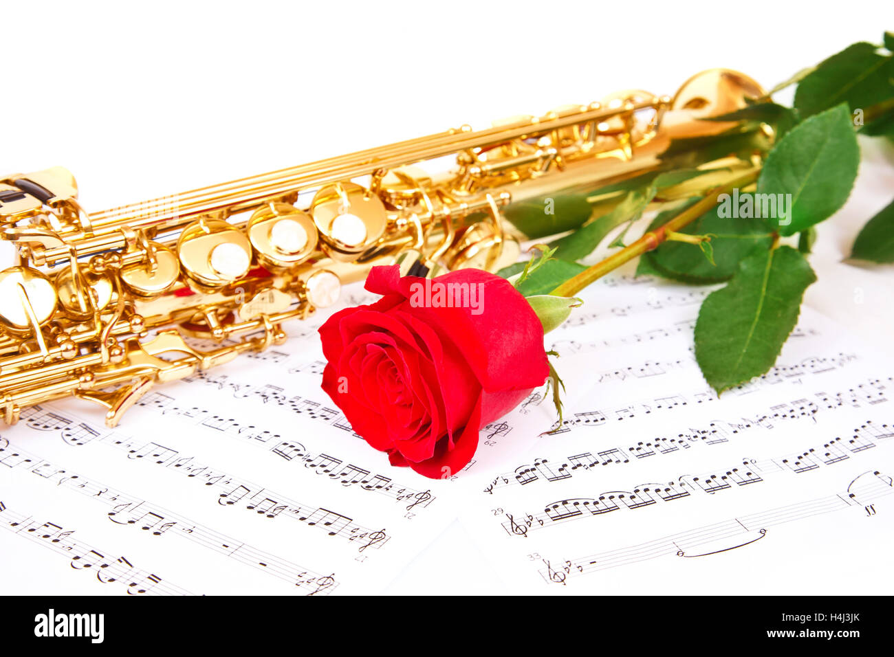 Musical notes and saxophone with red rose Stock Photo - Alamy