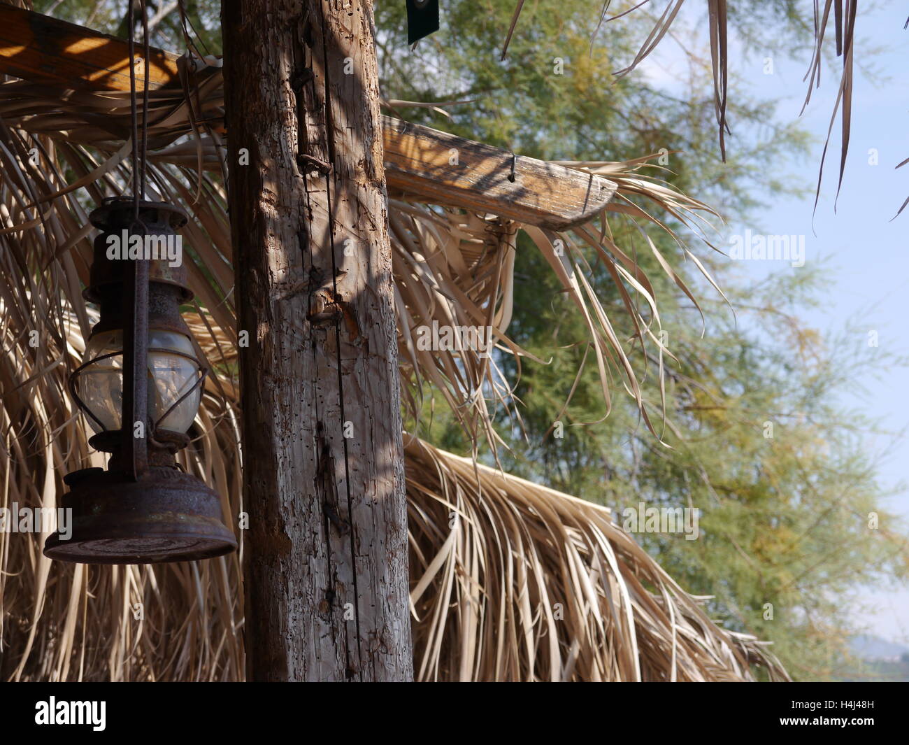Old rusty oil lamp on beach Stock Photo - Alamy